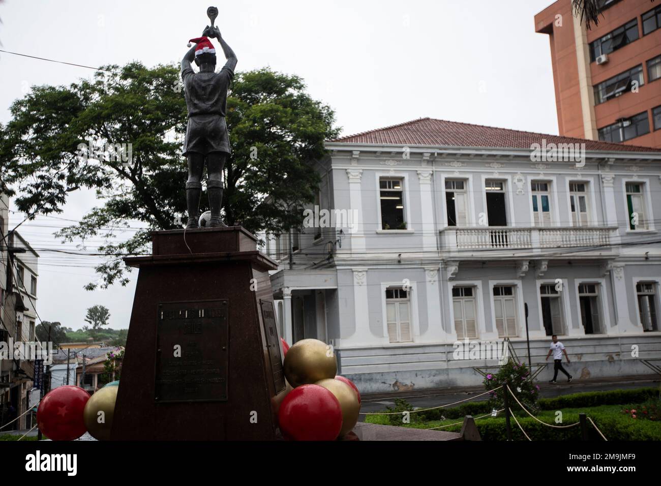 A statue of Brazil's former soccer great Pele holds up the Jules Rimet ...