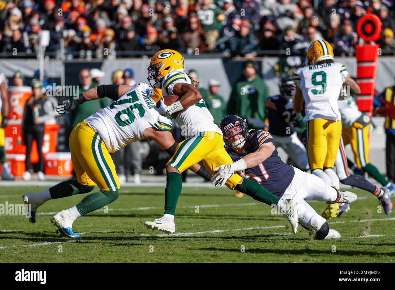 Chicago Bears linebacker Jack Sanborn (57) tackles Green Bay Packers ...