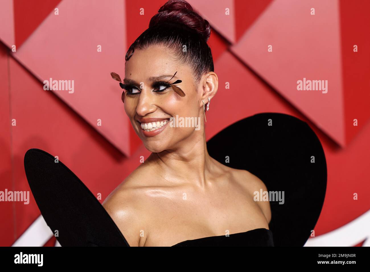 Raye poses for photographers upon arrival at the British Fashion Awards ...