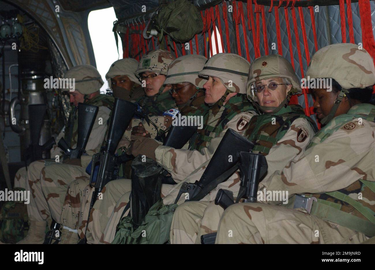 US Army (USA) soldiers sits in a CH-47 Chinook helicopter bound for the ...