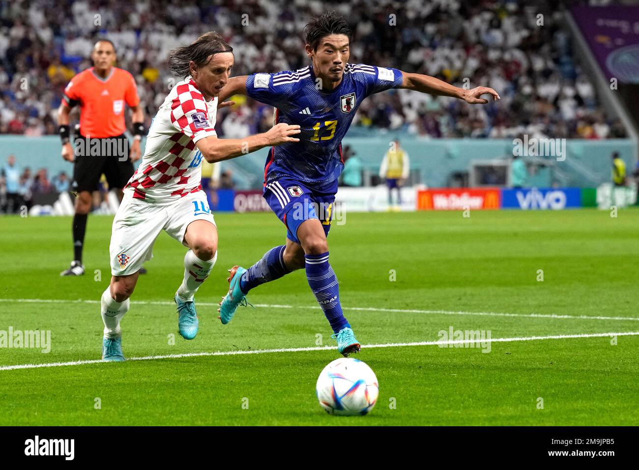 Croatia's Luka Modric, left, challenges with Japan's Daichi Kamada ...