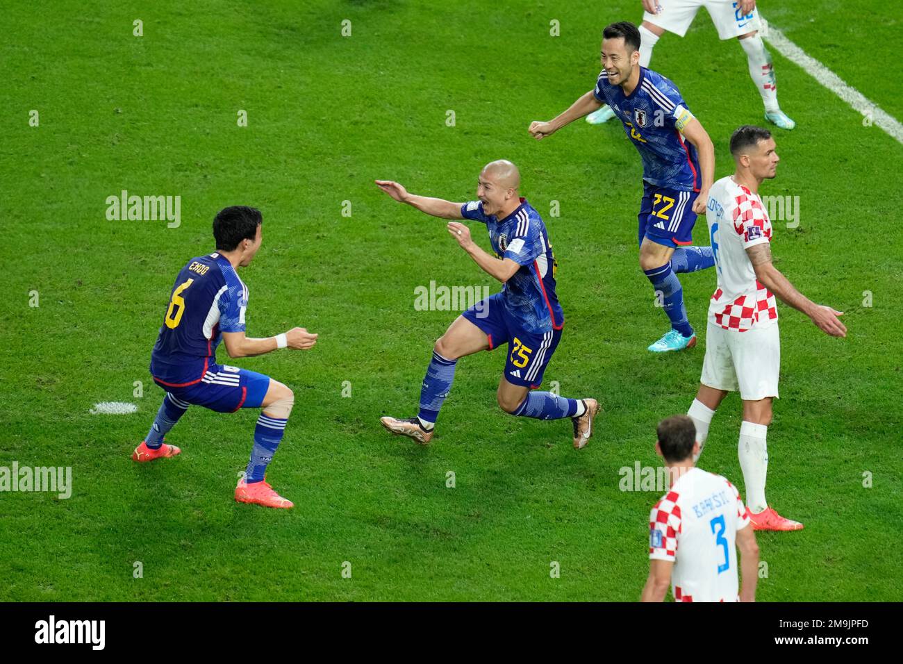 Japan's Daizen Maeda celebrates after scoring his side's opening goal ...
