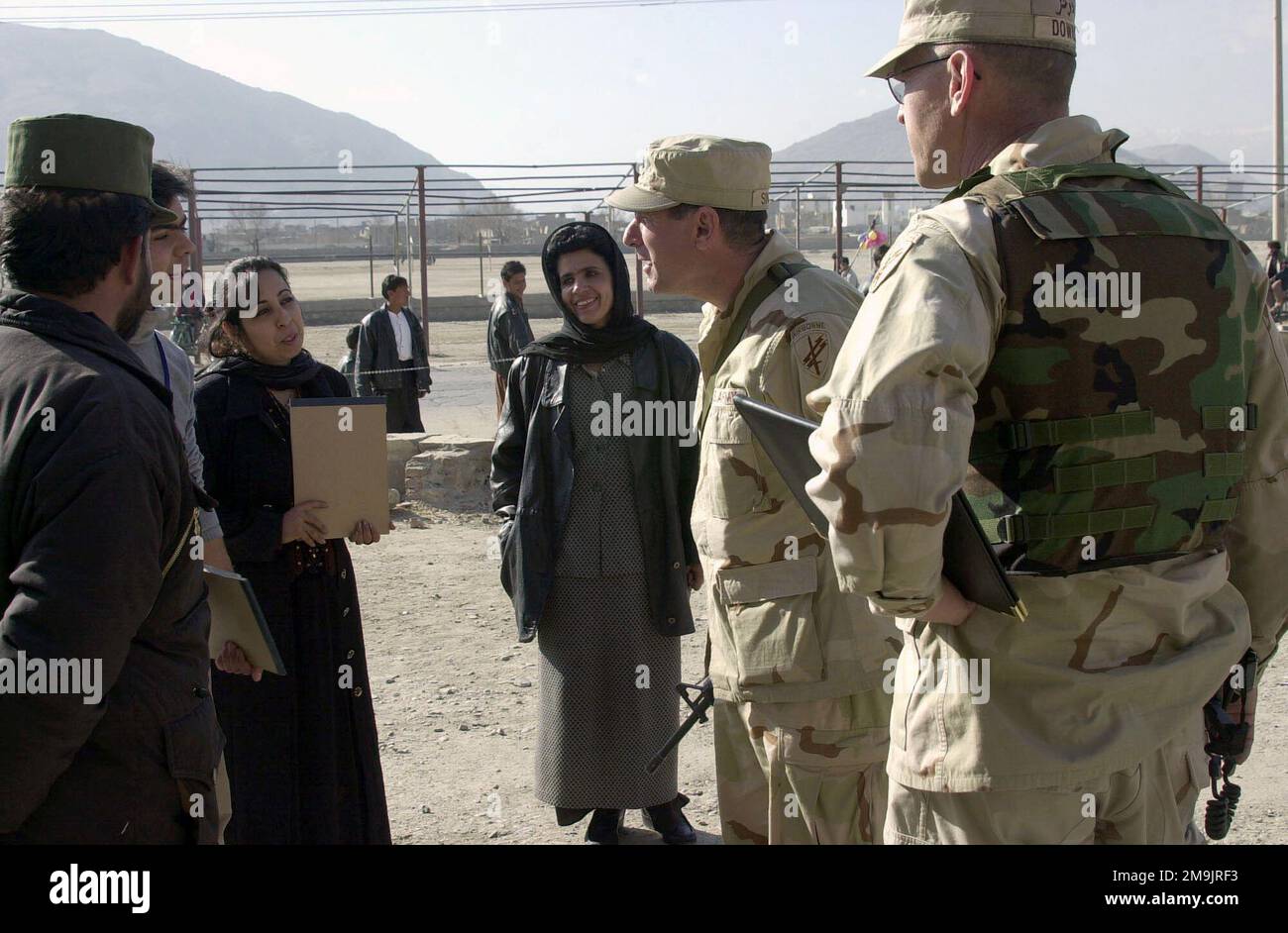 US Army (USA) Major (MAJ) Timothy Downs, right, with the Coalition ...
