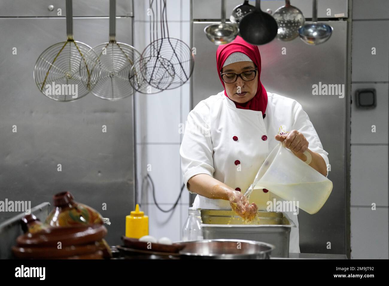 Moroccan chef Fatma Taouzani prepares food in the kitchen inside the Marrakech restaurant, in ...