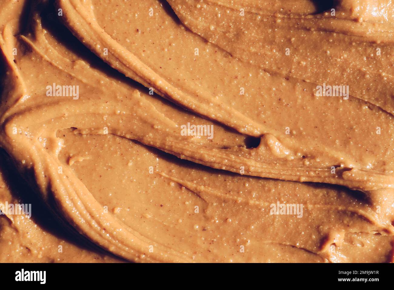 Peanut butter texture background. Creamy smooth brown nut spread smear ...