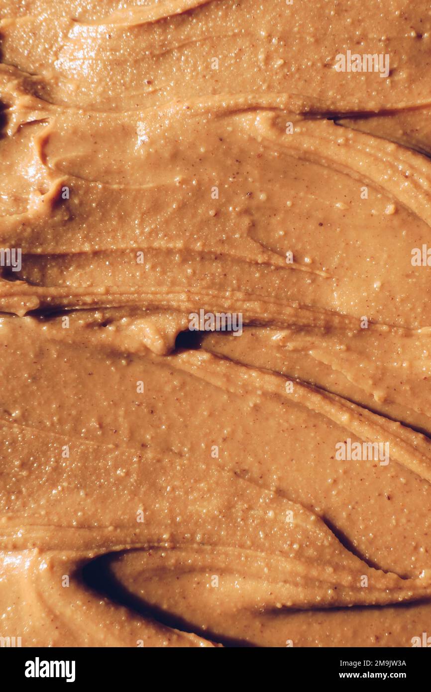 Peanut butter texture background. Creamy smooth brown nut spread smear ...