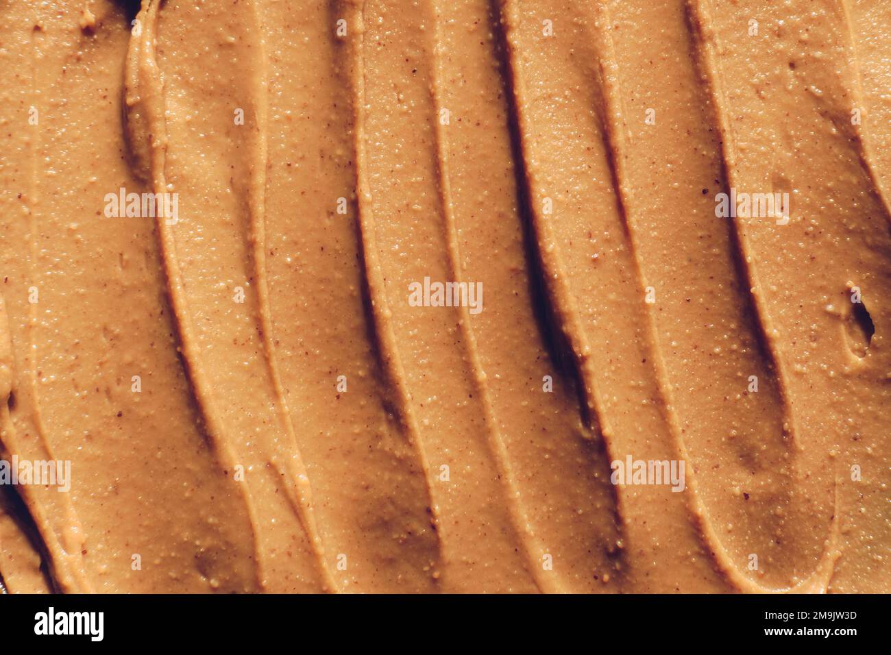Peanut butter texture background. Creamy smooth brown nut spread smear ...