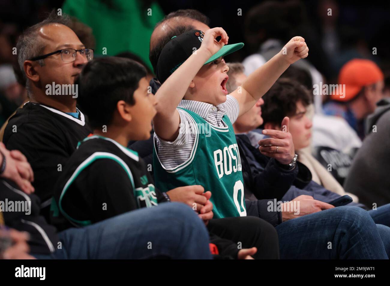 A young Boston Celtics fan reacts during the second half of an NBA ...