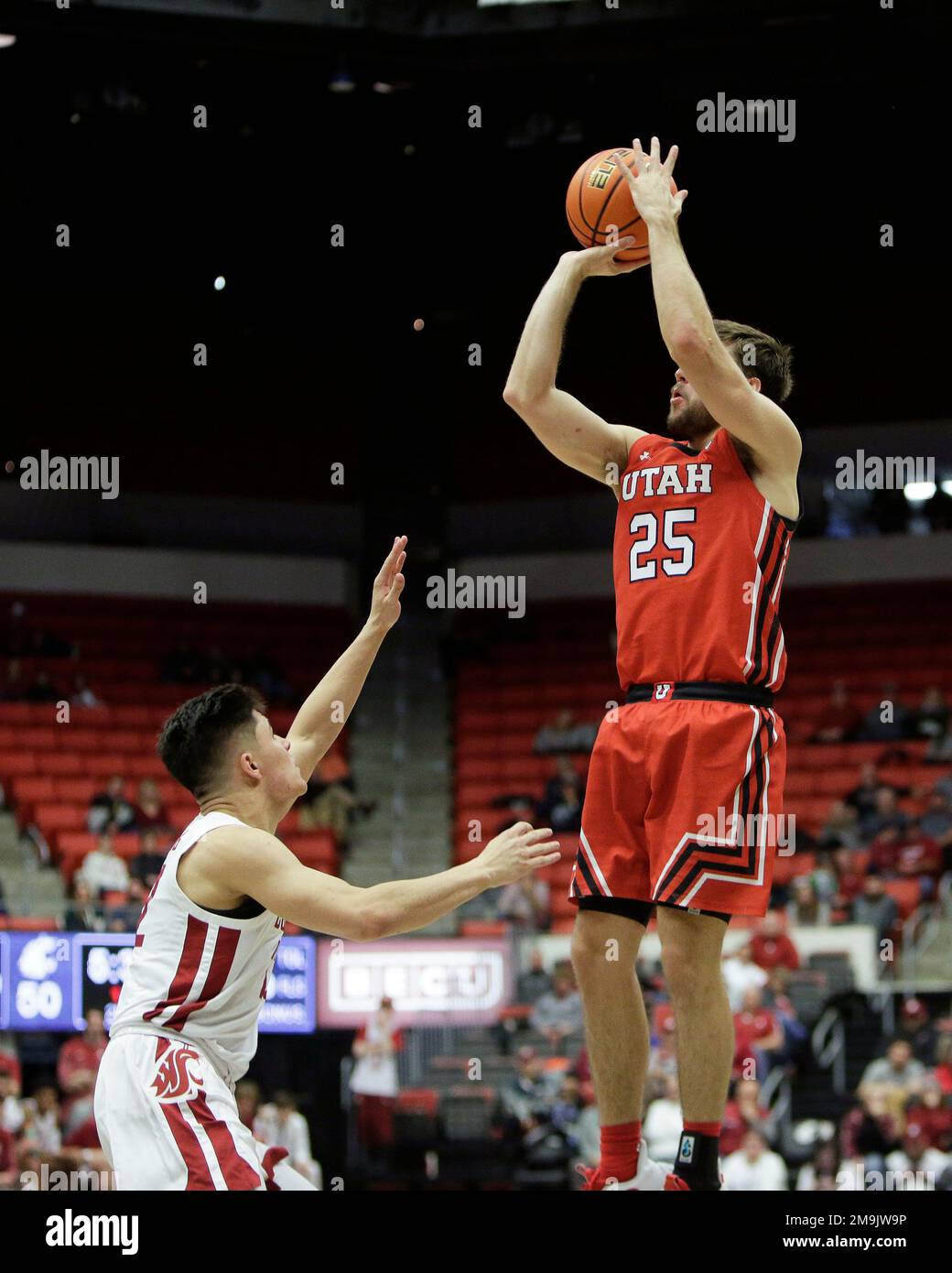 Utah guard Rollie Worster, right, shoots while defended by Washington ...
