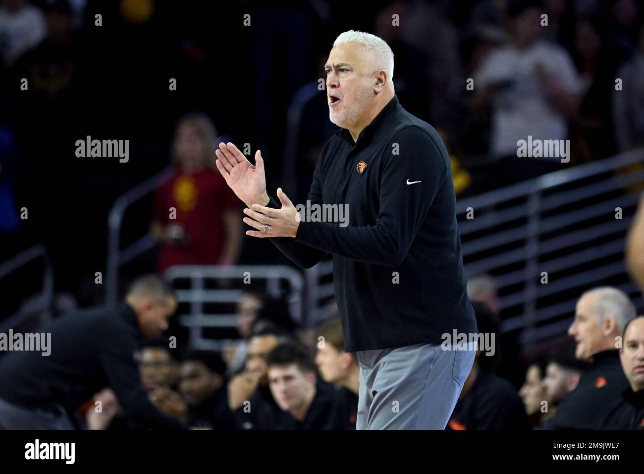 Oregon State head coach Wayne Tinkle applauds his players during the ...