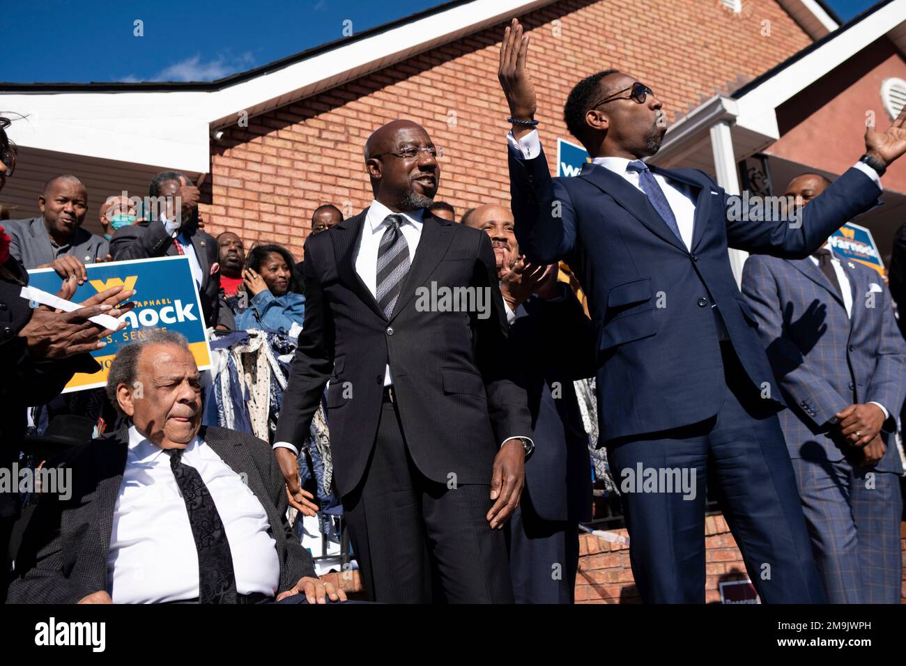 FILE - Sen. Raphael Warnock, D-Ga., center, prepares to speak at a ...