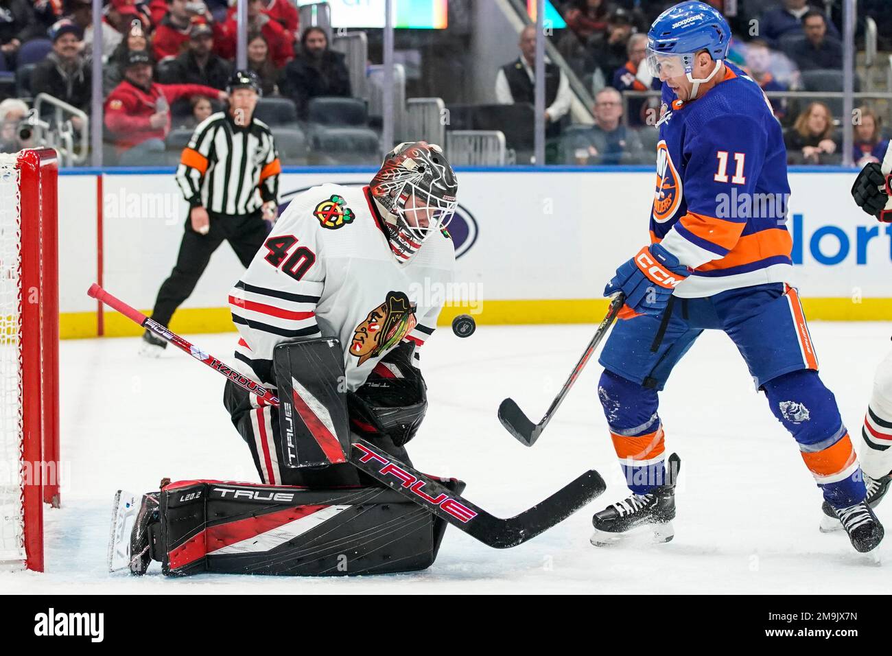 Chicago Blackhawks goaltender Arvid Soderblom (40) makes a save next to ...