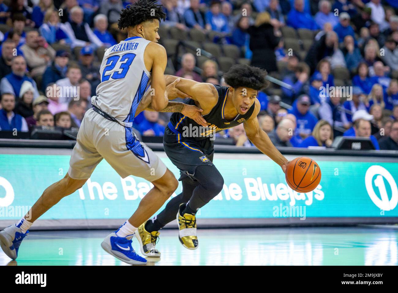 UC Riverside's Zyon Pullin (5) dribbles the ball against Creighton's Trey Alexander (23) during ...