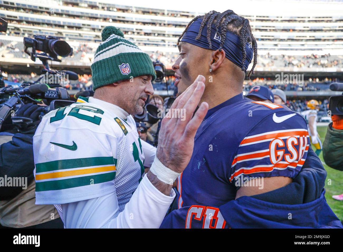 Green Bay Packers quarterback Aaron Rodgers (12) talks to Chicago Bears ...