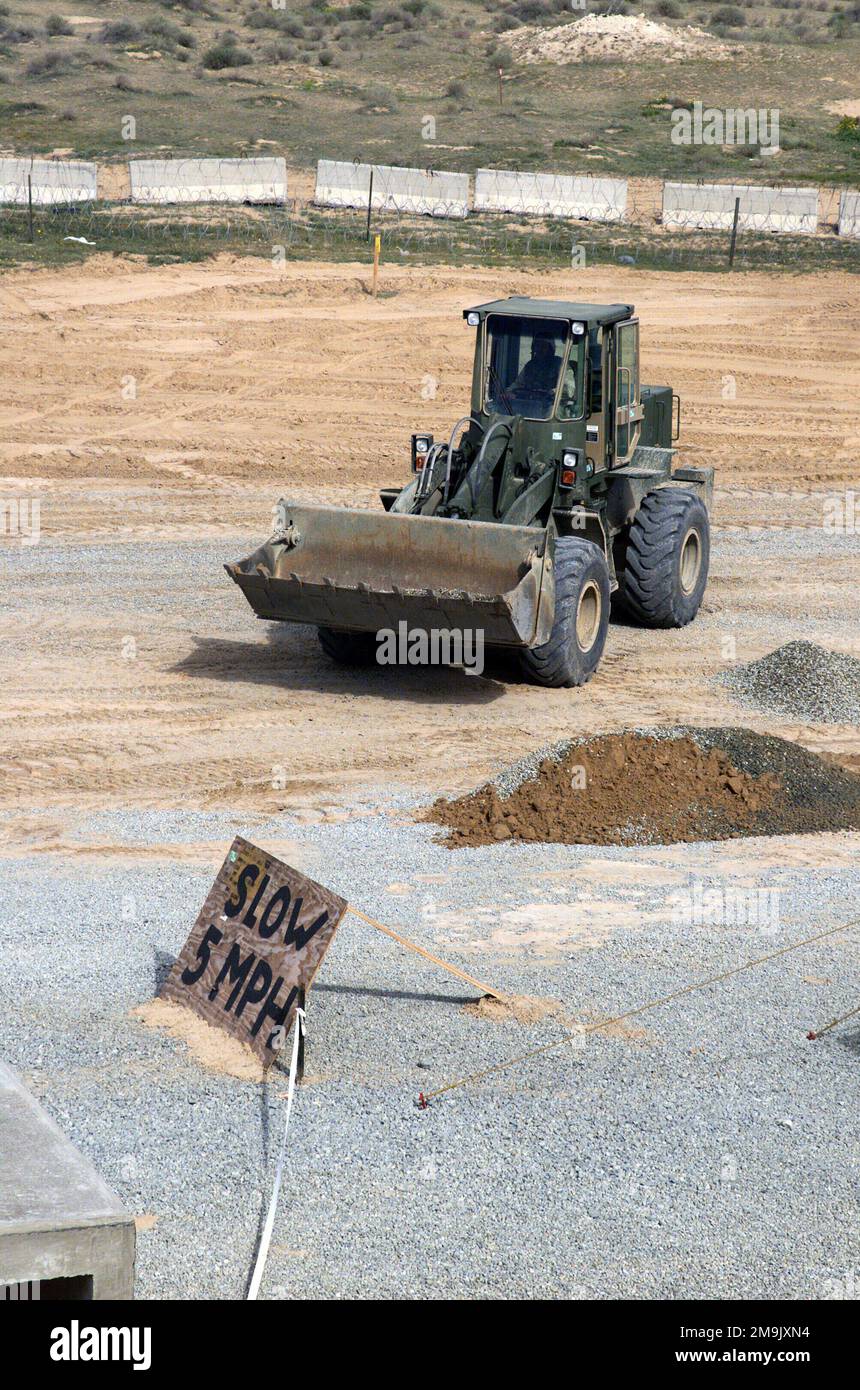 An earthmoving Rough Terrain Vehicle works at the construction site of ...