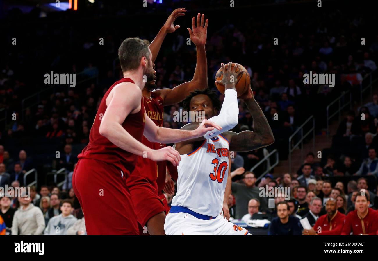 New York Knicks forward Julius Randle (30) is guarded by Cleveland ...