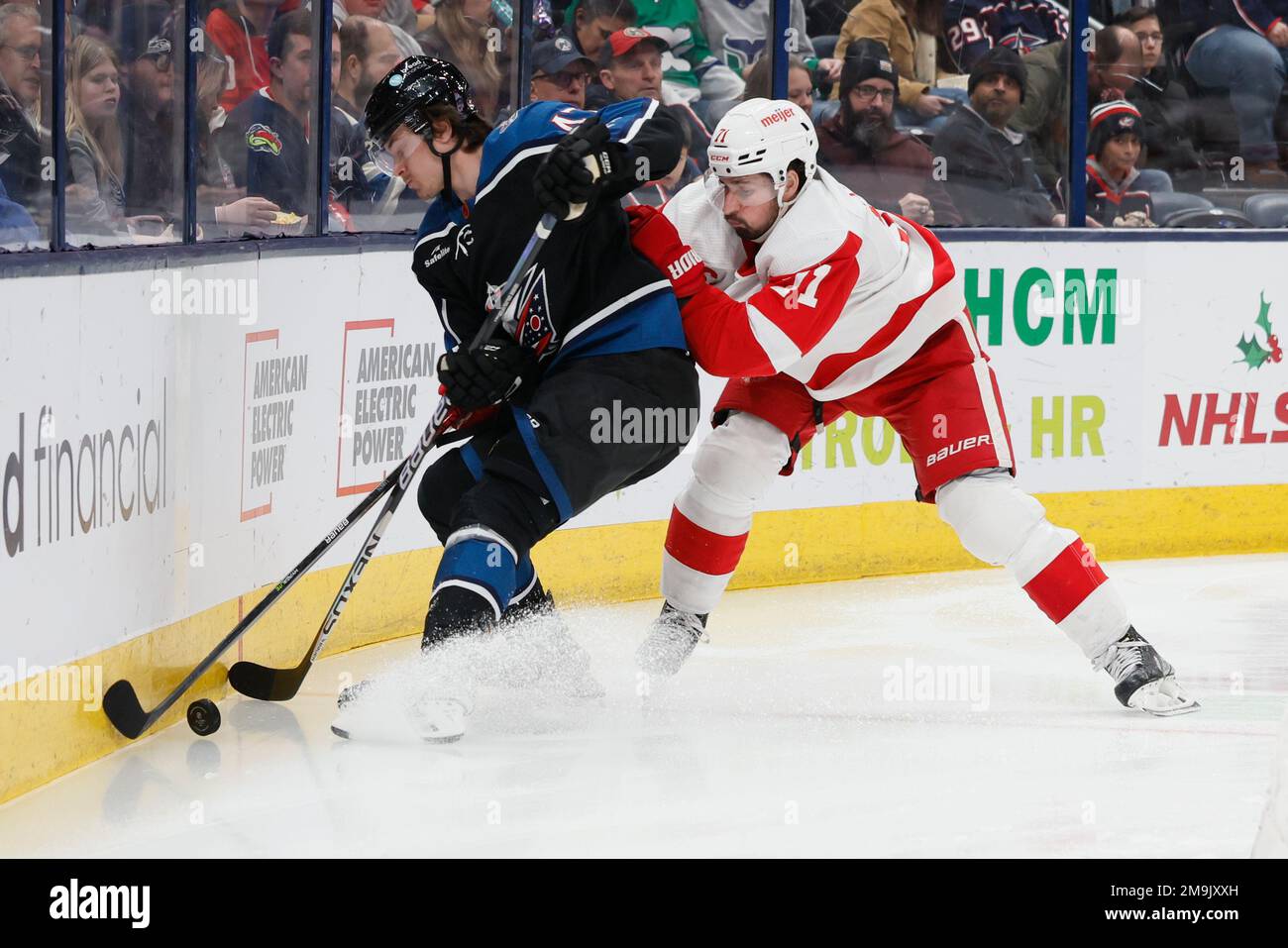 Columbus Blue Jackets' Marcus Bjork, left, and Detroit Red Wings' Dylan ...