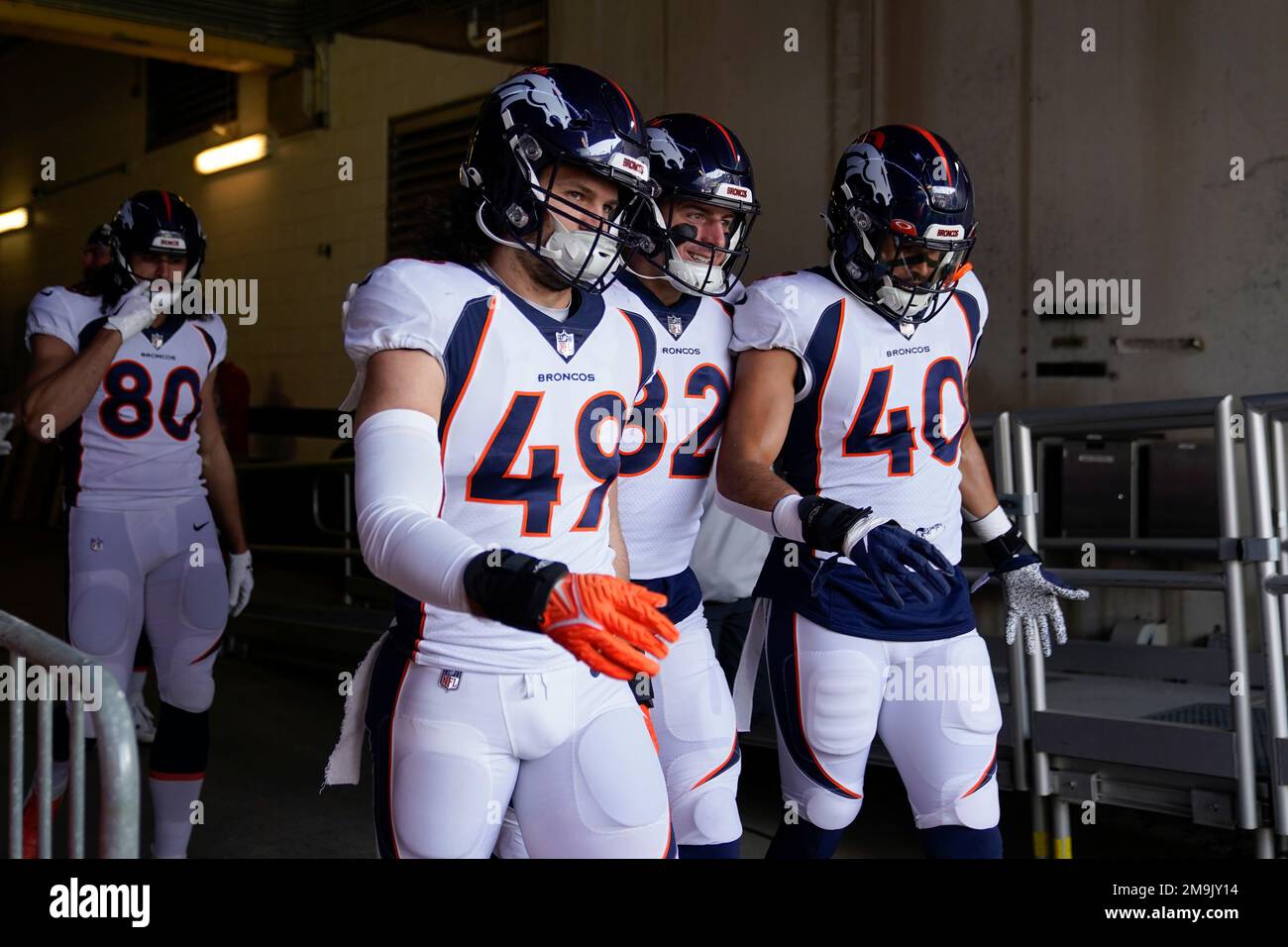 Denver Broncos linebacker Alex Singleton (49), tight end Eric Saubert ...