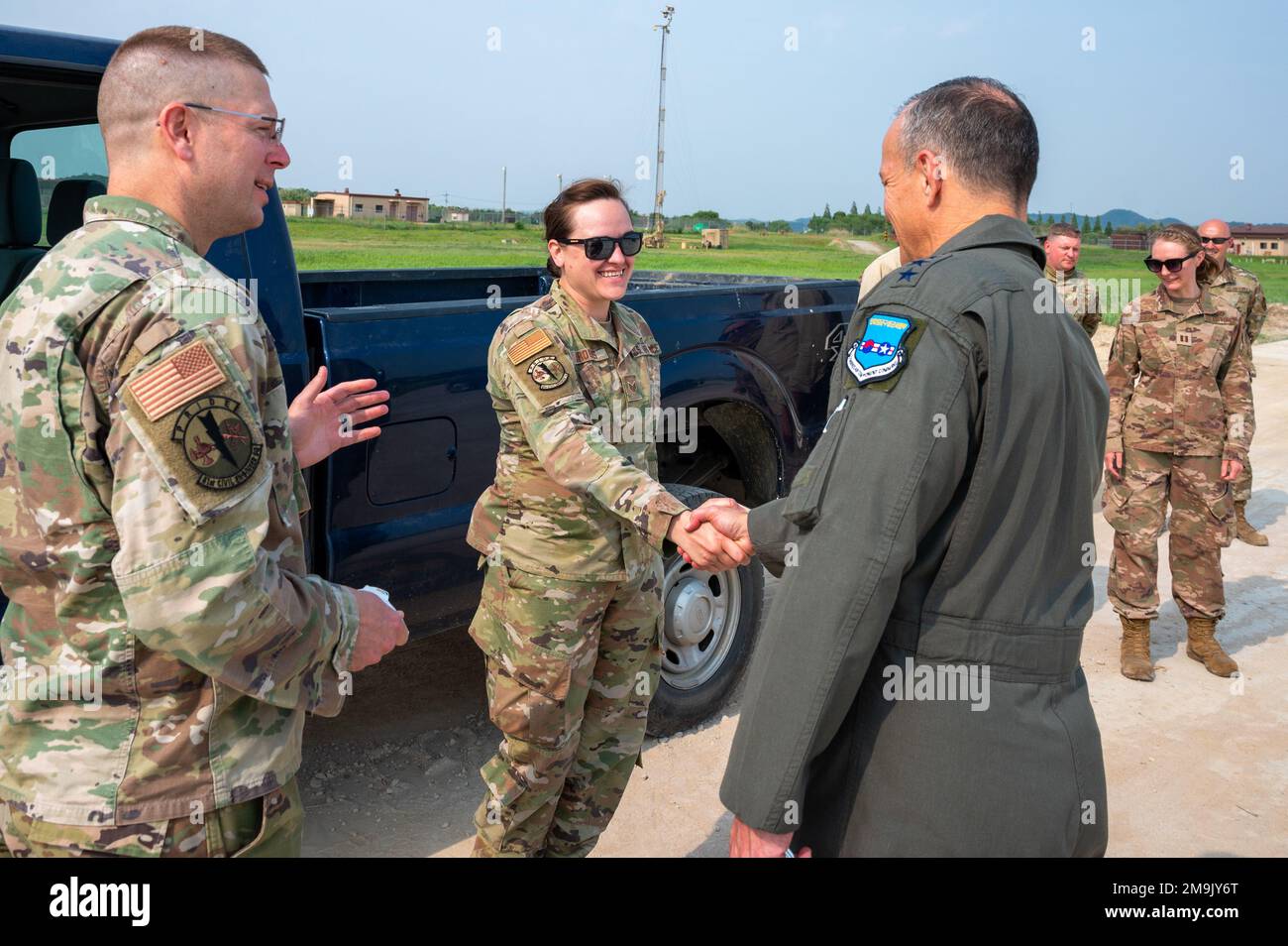 Lt. Gen. Scott Pleus, Seventh Air Force commander, shakes hands with ...