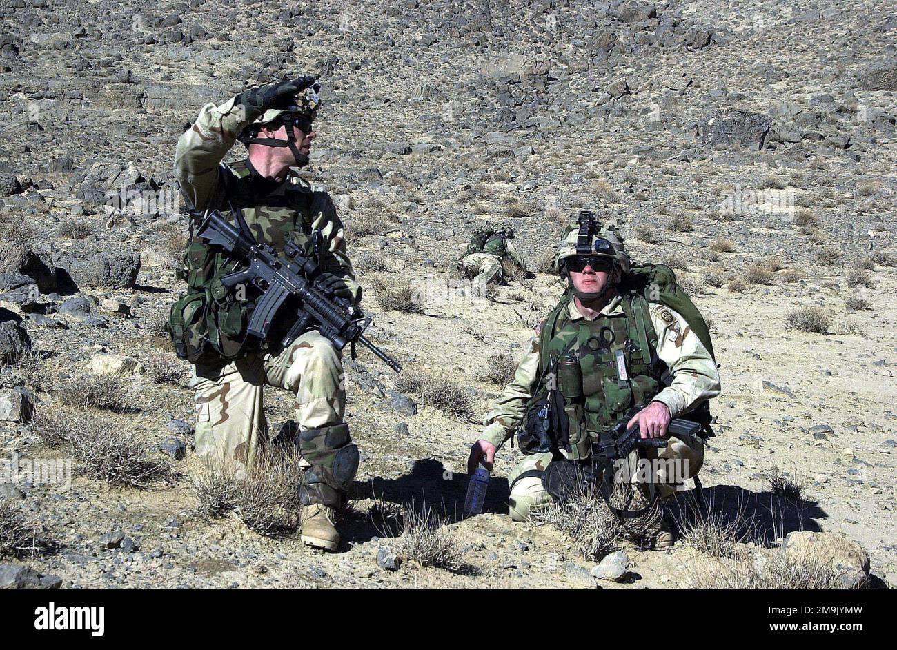 Armed with 5.56mm M4 Carbine, STAFF Sergeant (SSG) Matthew Duesbery ...