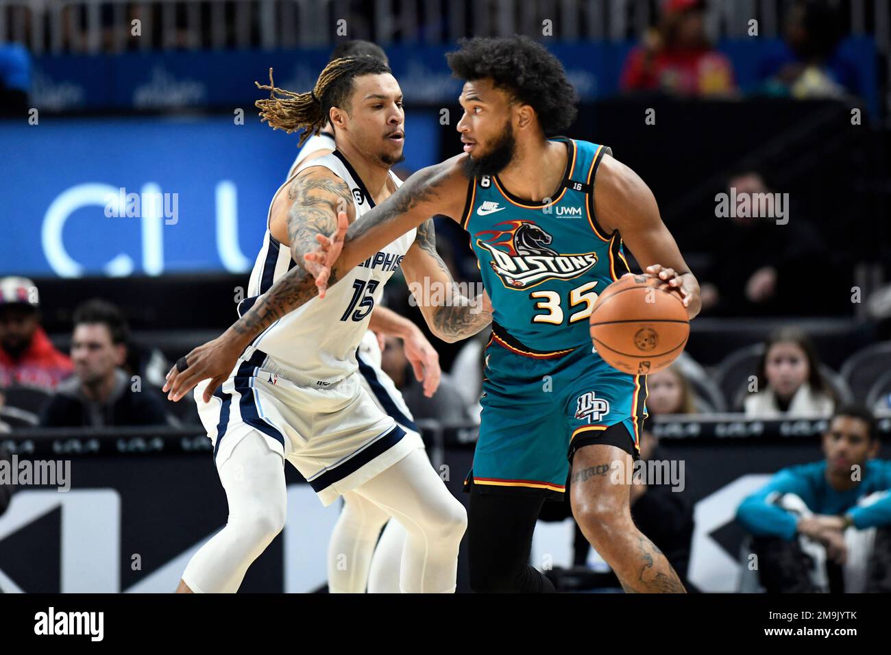 Detroit Pistons center Marvin Bagley III, right, tries to drive past ...