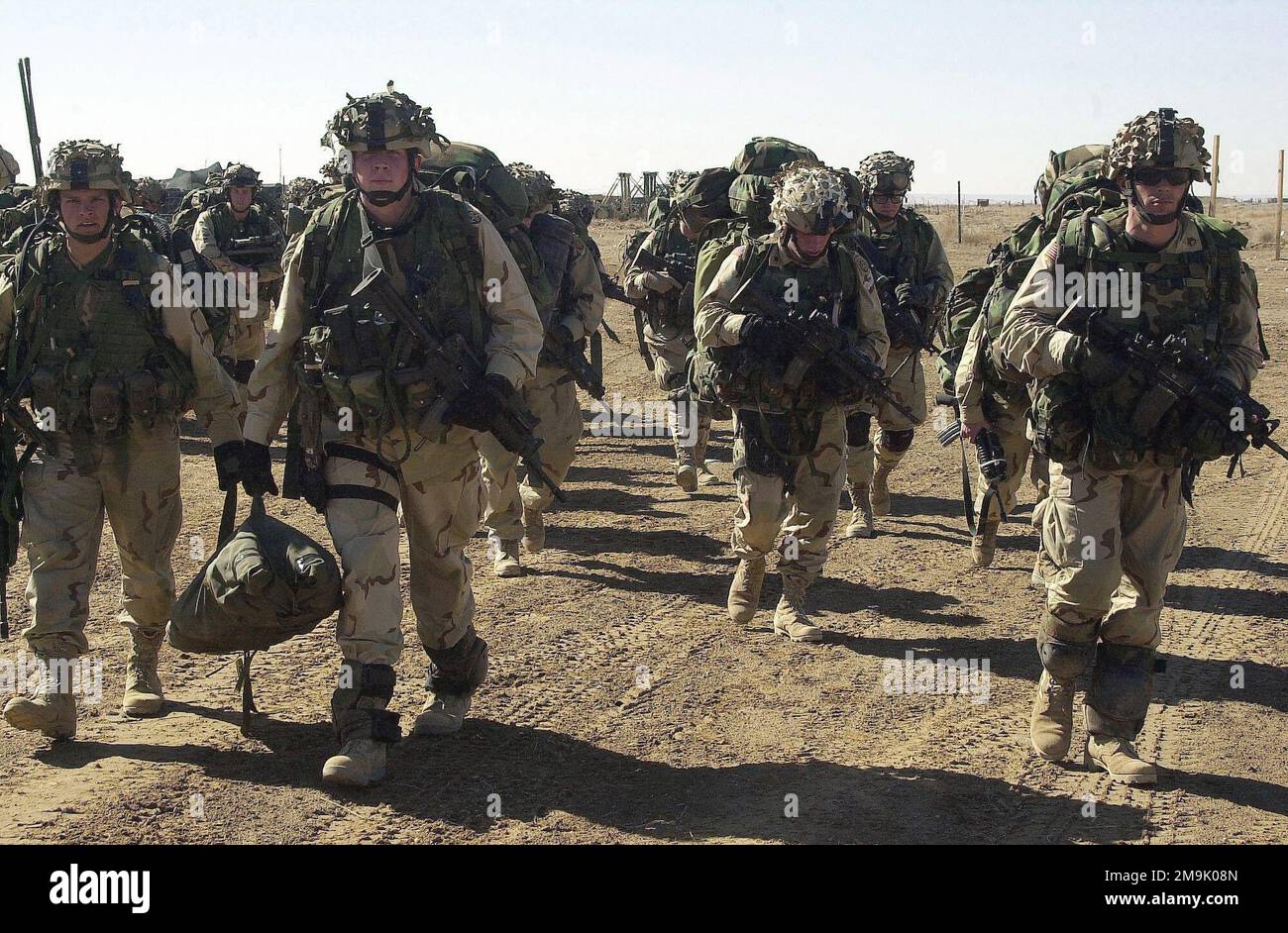 Armed with 5.56mm M4 Carbines, soldiers with "A" Company, 2nd Battalion ...