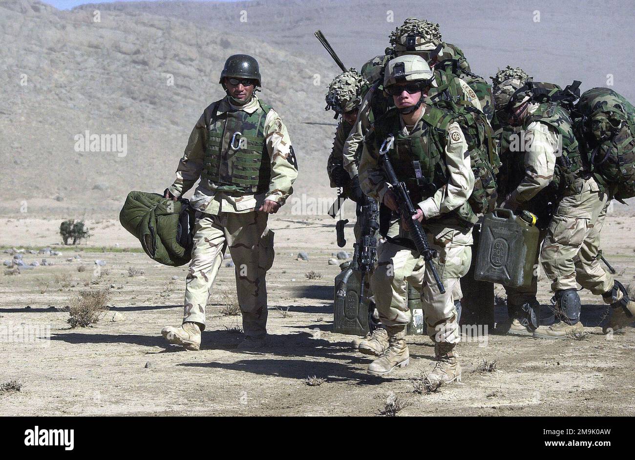 Armed with 5.56mm M4 Carbines, soldiers with "A" Company, 2nd Battalion ...