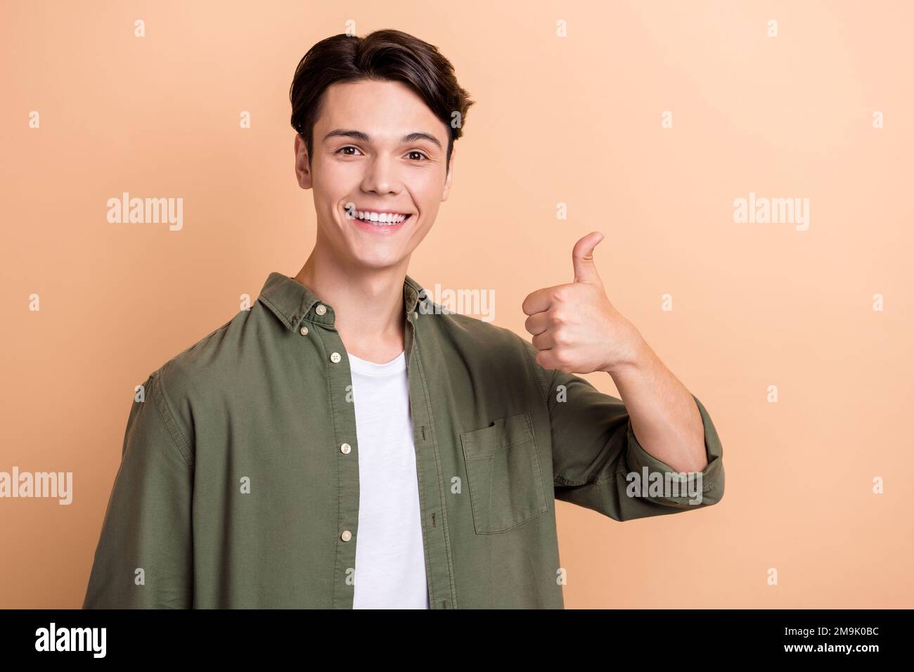Photo of satisfied good mood guy with brunet hair dressed khaki shirt ...