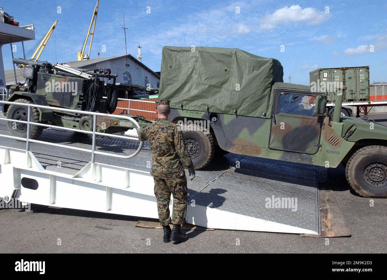 030201-M-7031A-010. [Complete] Scene Caption: As the US Marine Corps ...