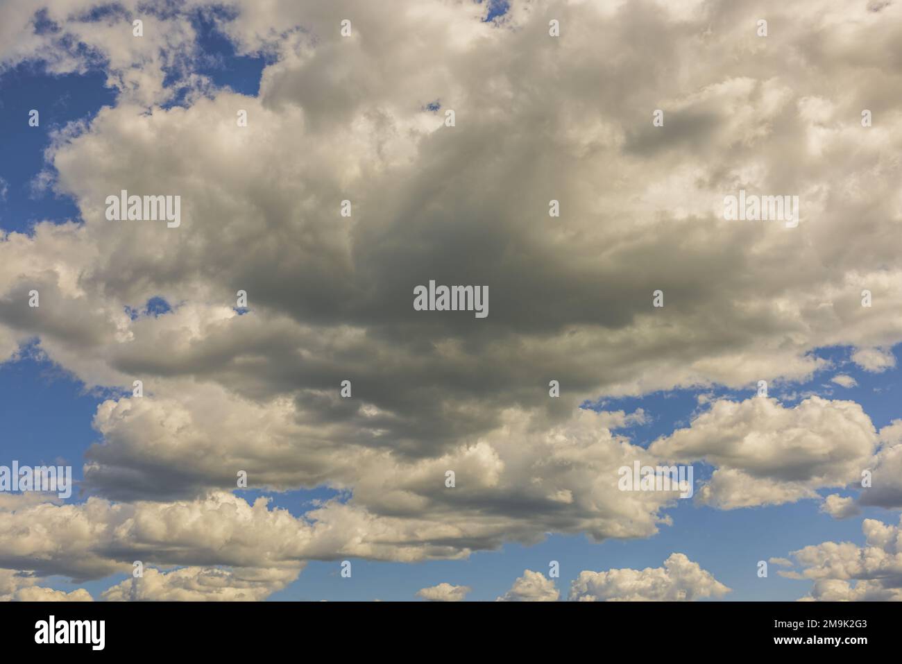 Close-up view of puffy white clouds on blue sky background. Beautiful ...
