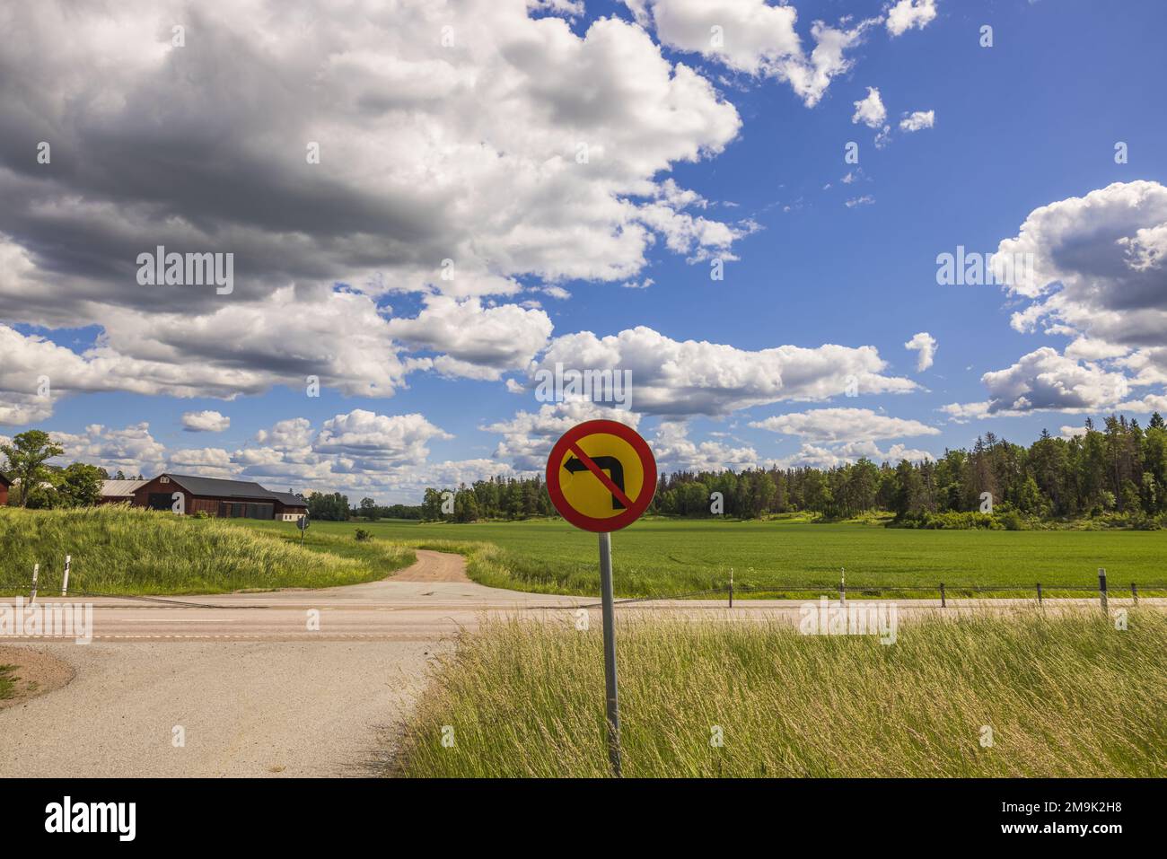 View of NO LEFT TURN road sign on road cross. Beautiful countryside ...