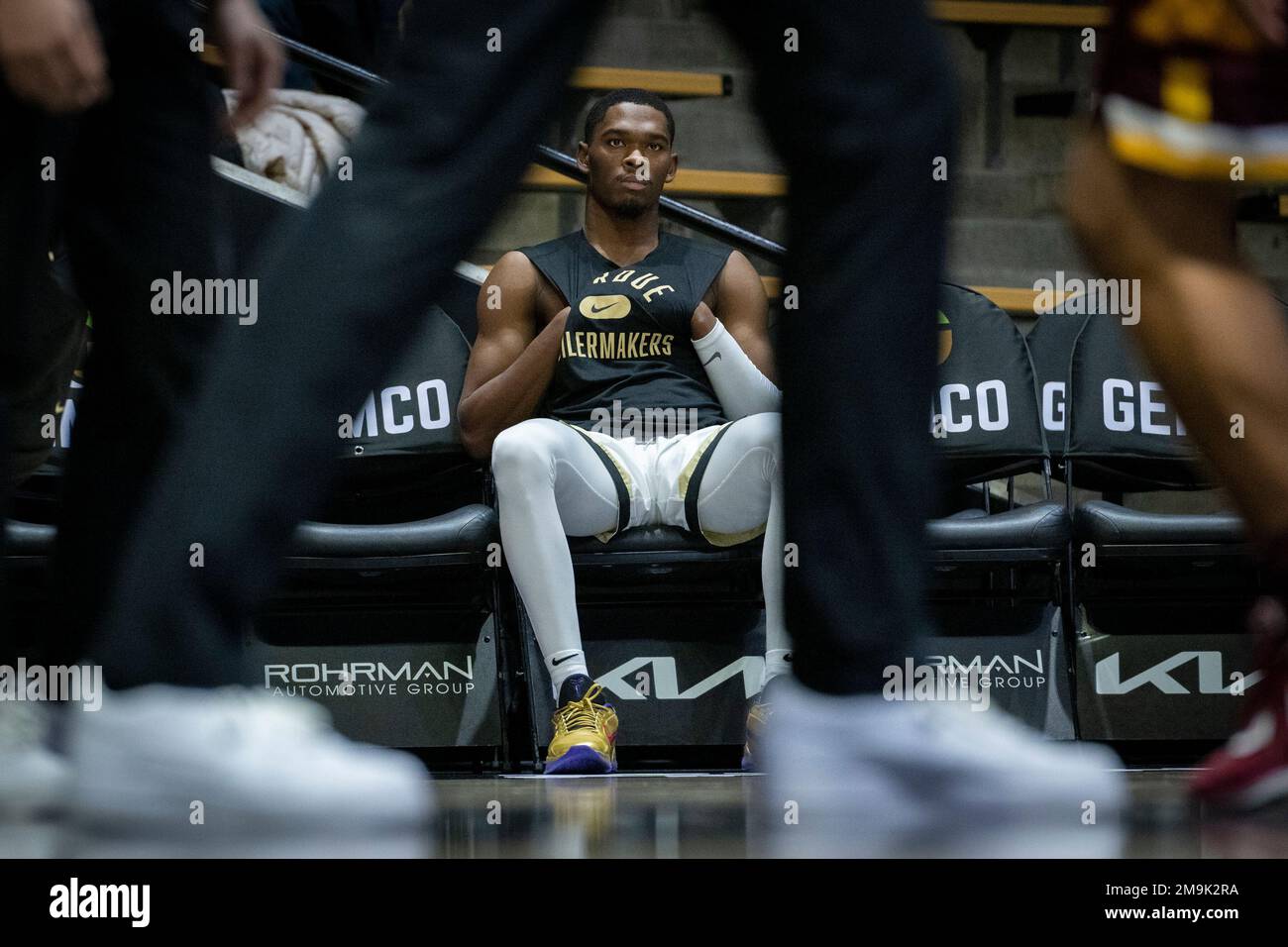 Purdue guard Brandon Newman (5) watches as Minnesota players warm up on ...