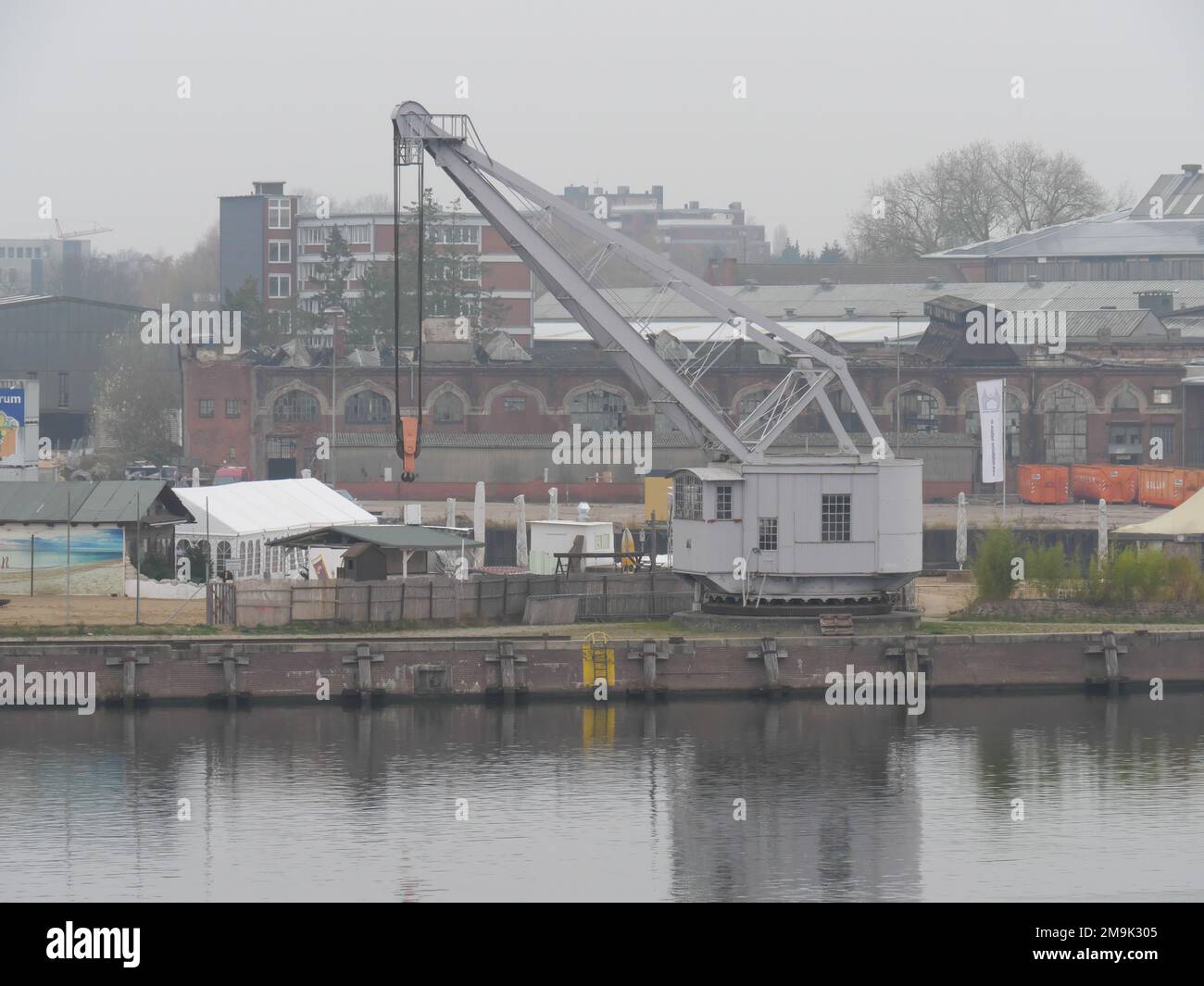 Old historical on rails running yellow loading crane for freighter for ...