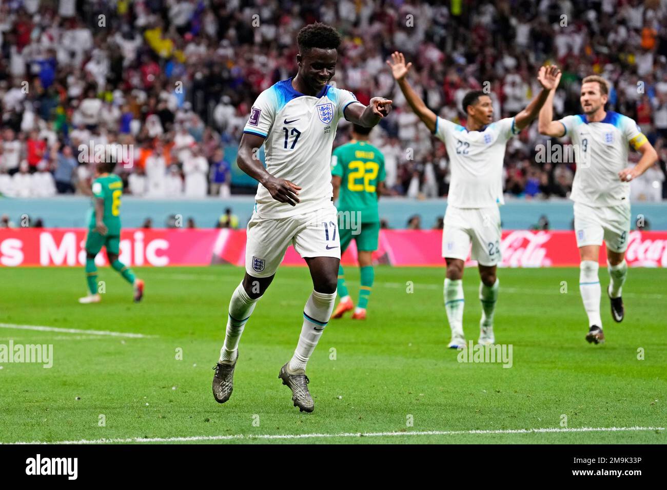 England's Bukayo Saka celebrates after scoring his side's third goal ...