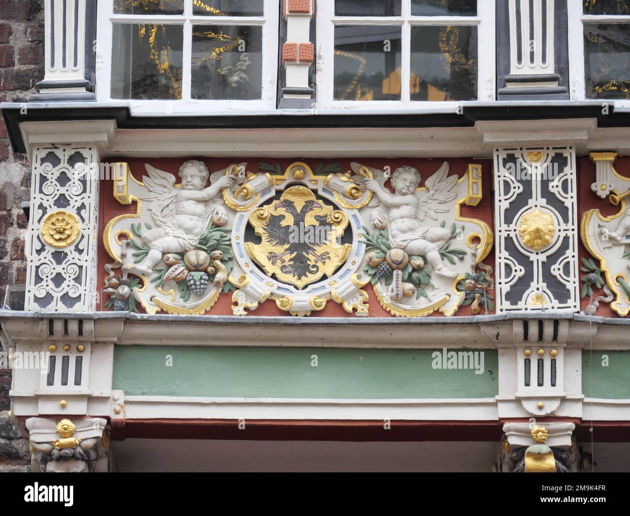 Detail of a bay window with angels on the facade of a historical ...