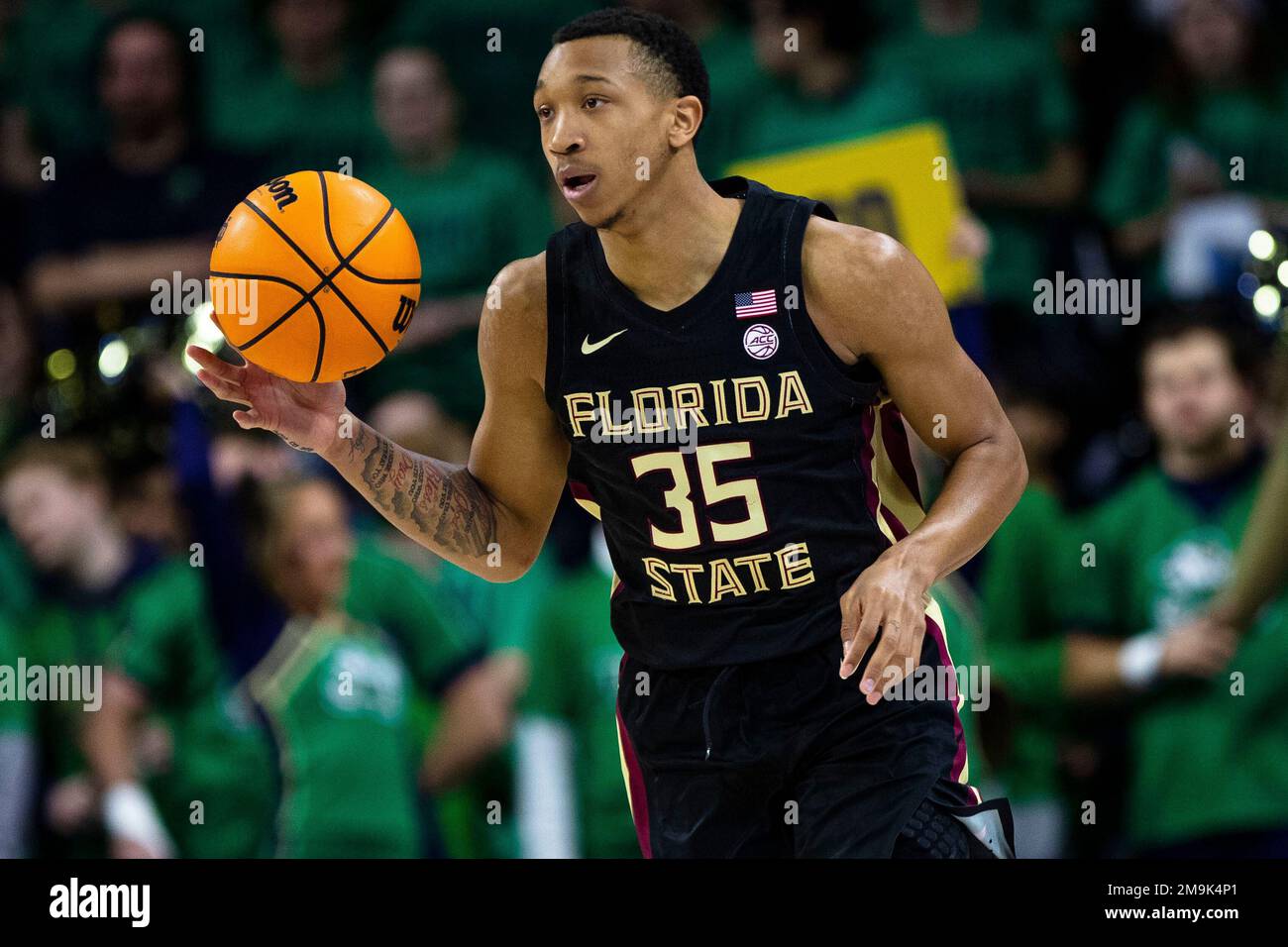 Florida State's Matthew Cleveland (35) dribbles down the court during ...