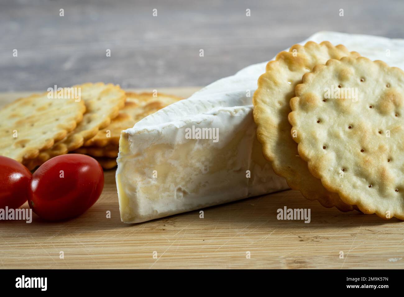 Vegetarian snack crackers brie cheese wedge hi-res stock photography ...