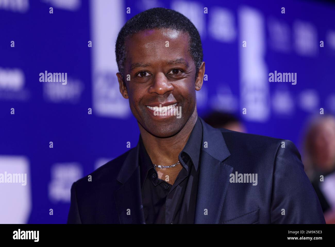 Adrian Lester poses for photographers upon arrival for 'The British ...