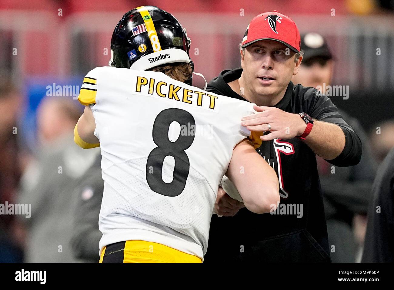 Pittsburgh Steelers quarterback Kenny Pickett (8) speaks with Atlanta ...