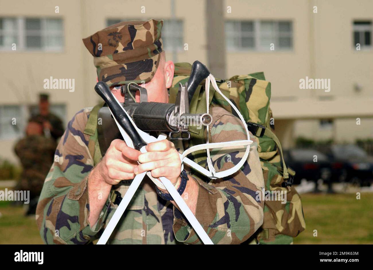 Armed with a Colt 5.56mm M16A2 Rifle, US Marine Corps (USMC) Corporal ...