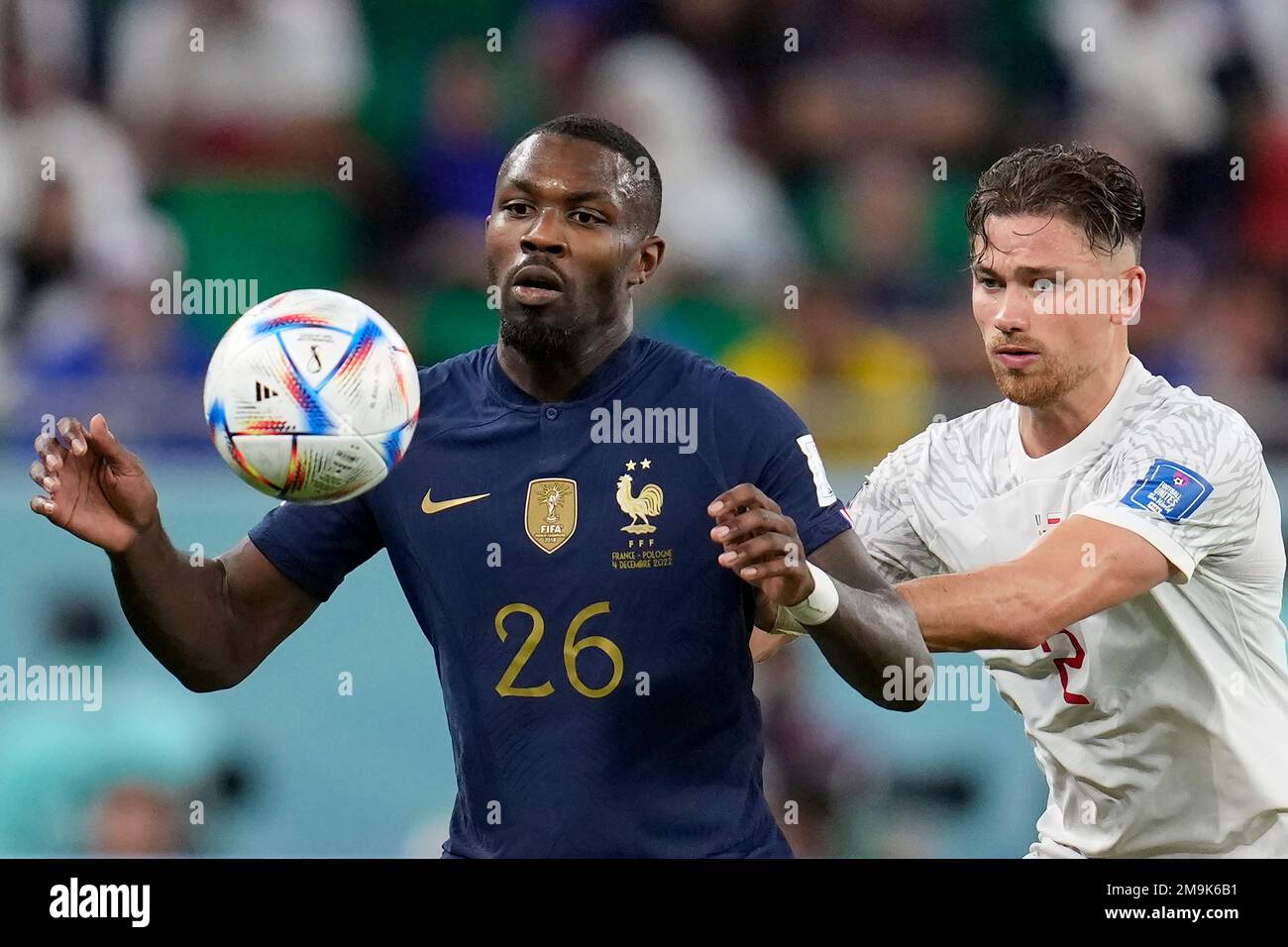 France's Marcus Thuram, left, and Poland's Matty Cash, right, fight for ...