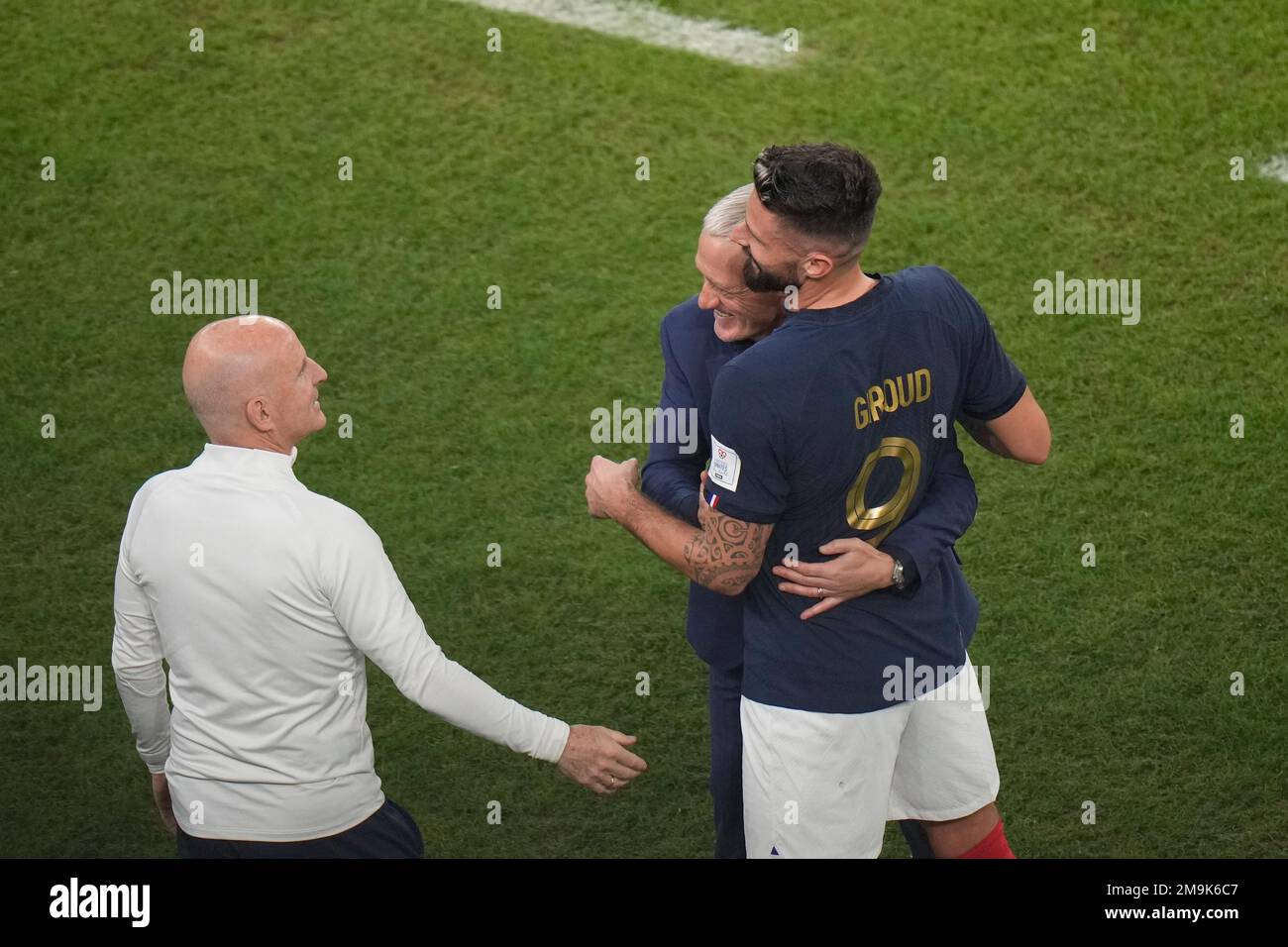 France's head coach Didier Deschamps, center, embraces player Olivier ...