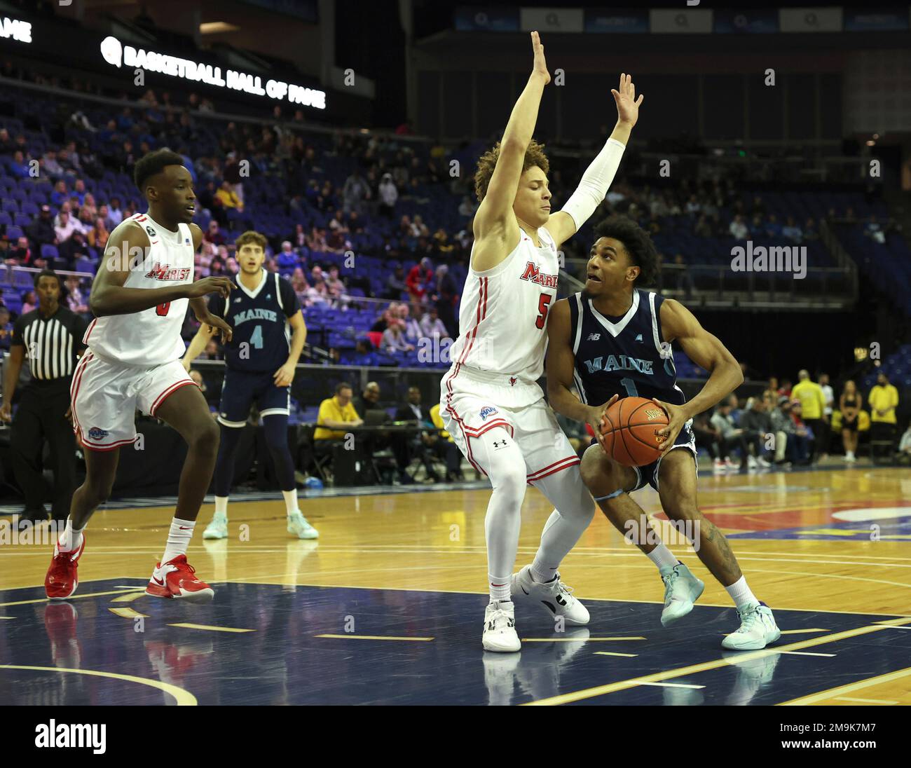 Maine Black Bears' Kellen Tynes (1) goes for the basket as Marist Red ...