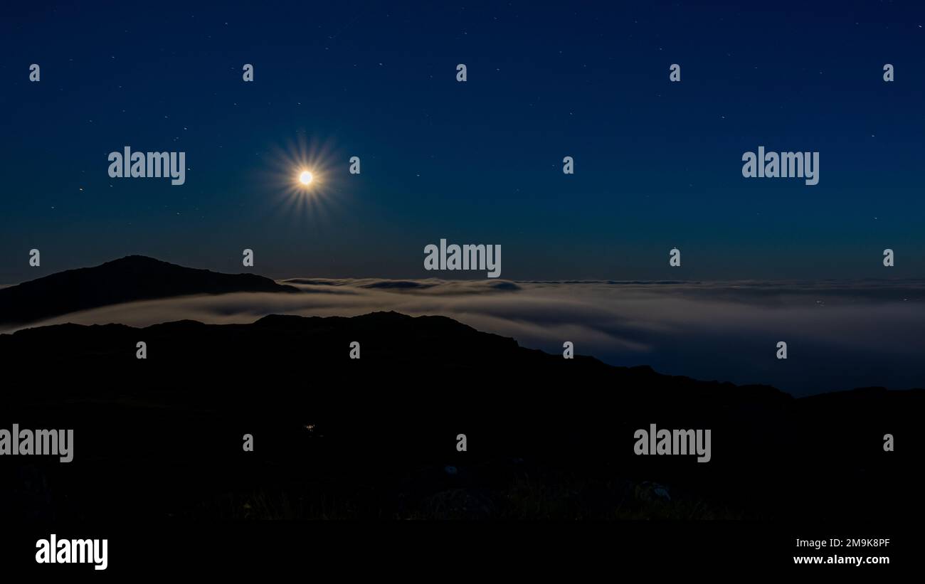 A night time cloud inversion in a lake district at national park with ...