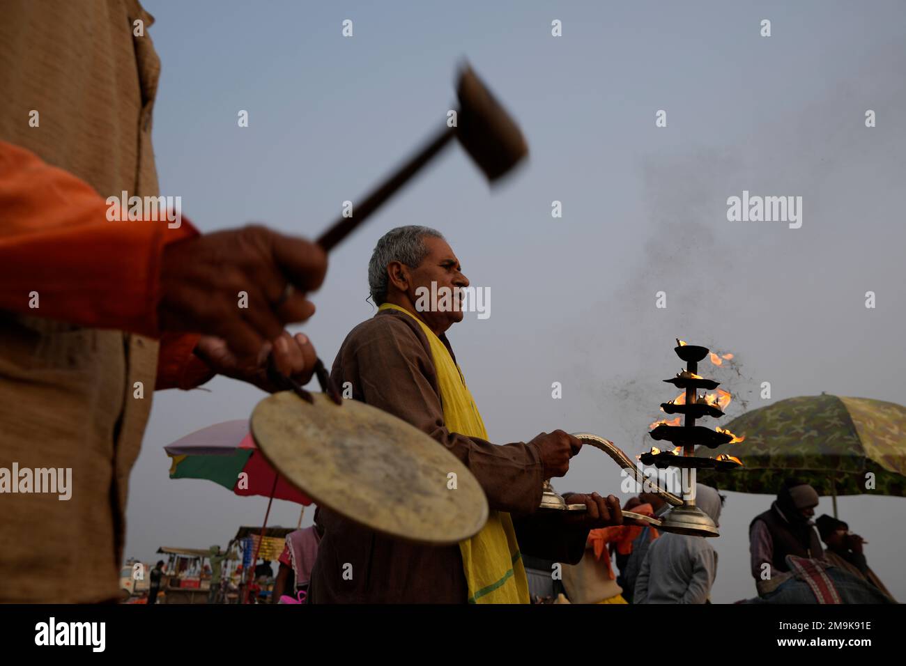 Hindu devotees perform morning rituals at Sangam, the confluence of the ...