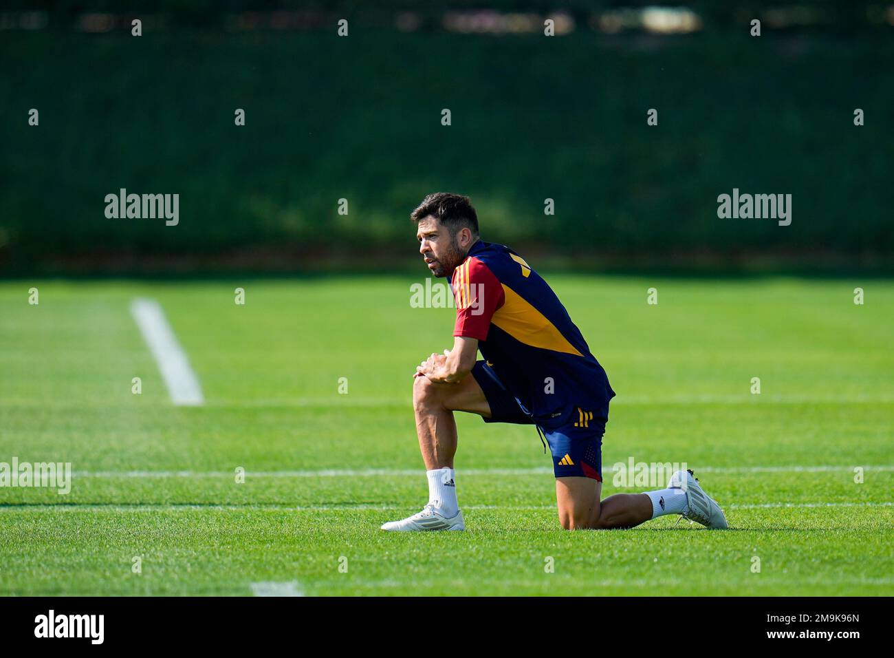 Spain's Jordi Alba stretches prior to a training session at Qatar ...