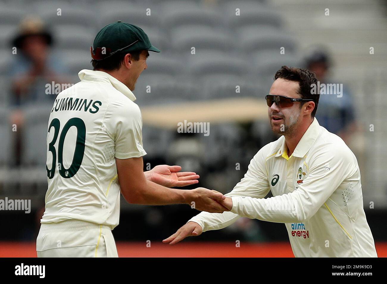 Australia's Travis Head, right, celebrates with teammate Pat Cummins ...