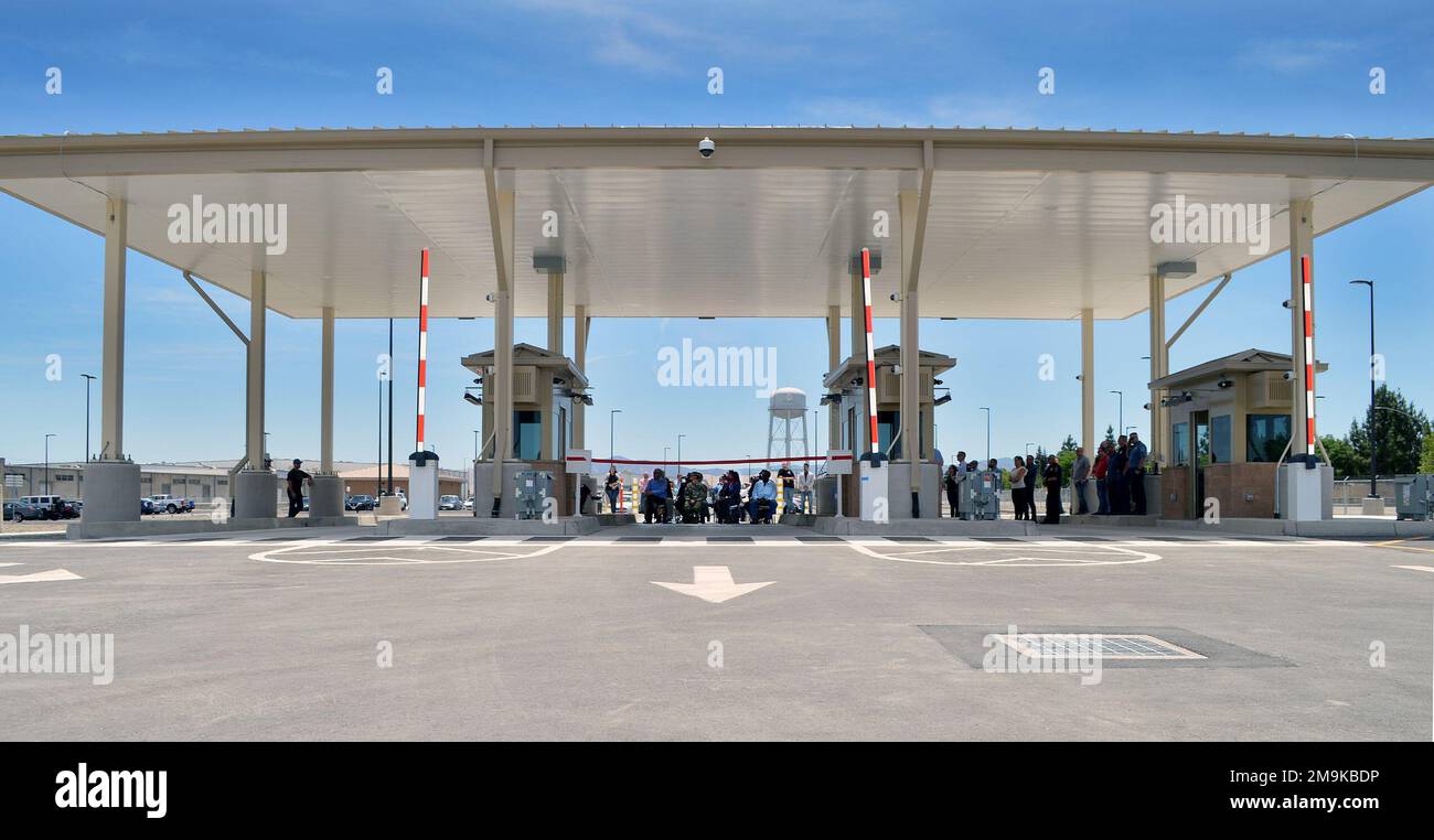 Dignitaries and guests sit under the awning of the brand new Main Gate ...
