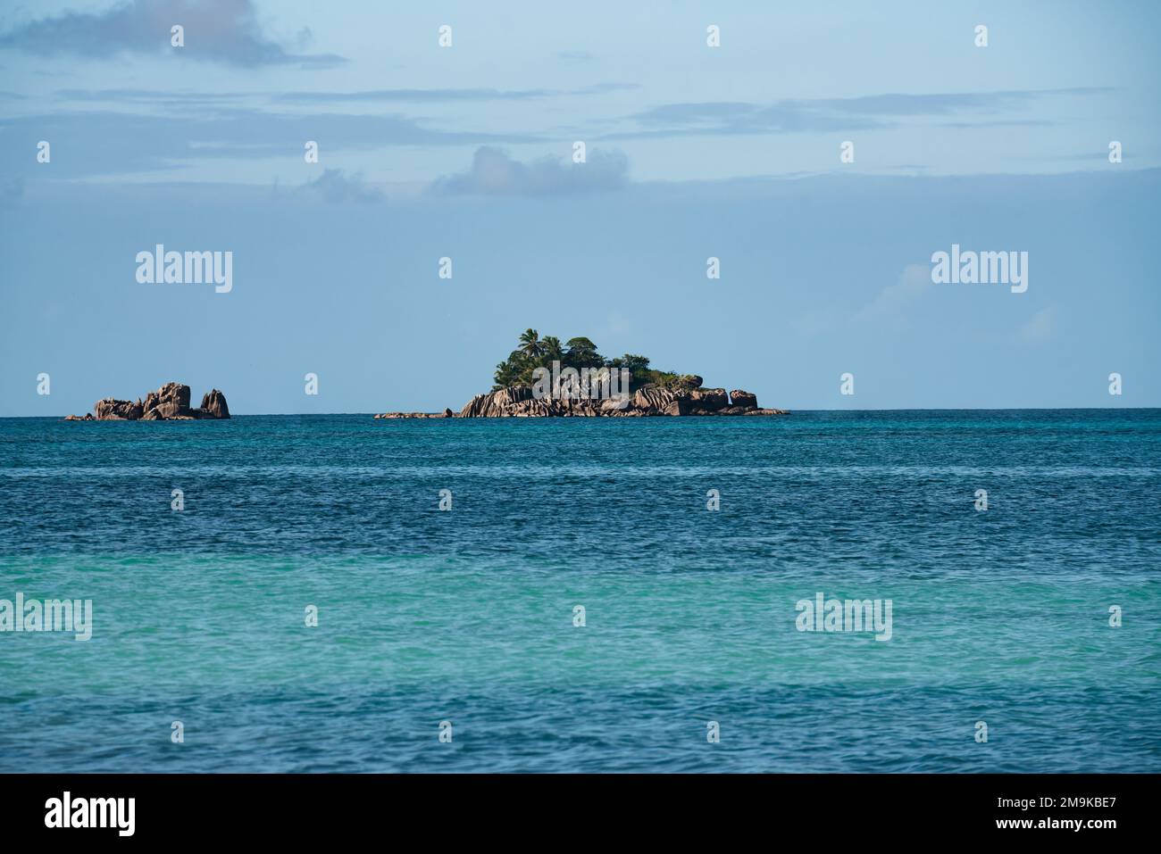 Rocky island off Cote D'Or in the evening light off the Seychelles ...