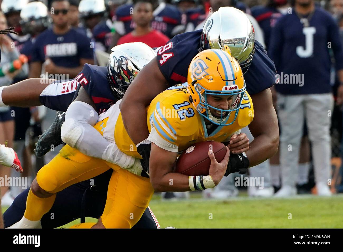 Southern University quarterback Glendon McDaniel (12) lunges forward ...